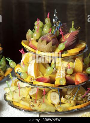 Various slices of fruits on the silver stand prepared for eating Stock ...