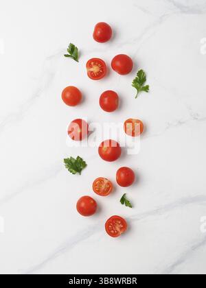 A vertical shot of a sliced orange and an empty white cup with tea bag ...
