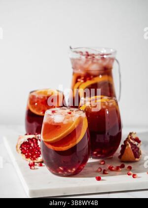 Delicious pomegranates on light background with space for text Stock ...