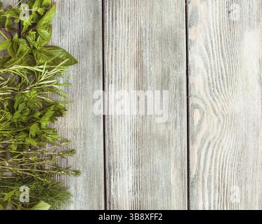 Fresh medicinal herbs on wooden background Stock Photo - Alamy
