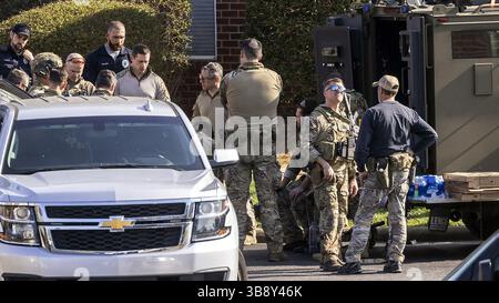 FBI officers work a scene on Friday, Jan. 16, 2026, in St. Paul, Minn ...