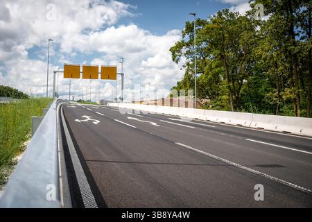 New Highway Ramp Leading to Roundabout with Fresh Road Markings Stock ...