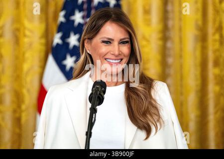 First lady Melania Trump smiles as they head to their planes at Daytona ...