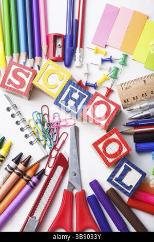 colored notebooks, colored pencils on a light table. Place for your ...