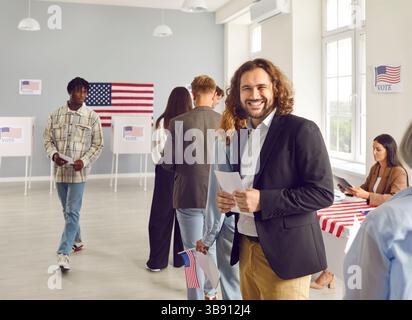Young american voter smiling happy putting vote in ballot box at ...