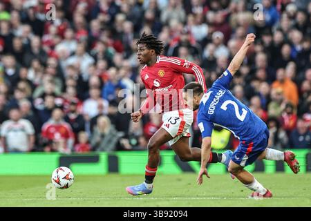 Patrick Dorgu of Manchester United breaks with the ball during the ...