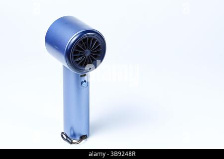 Small plastic Portable fan side view, isolated on white background ...