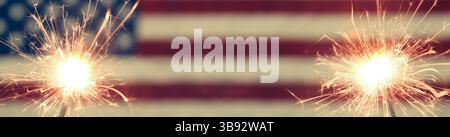 Lit sparkler burning in front of American Flag Stock Photo - Alamy