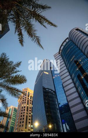 A captivating view of Doha's towering skyscrapers illuminated at night ...