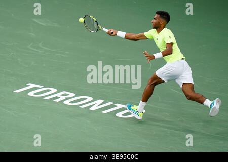 Felix Auger-Aliassime, of Canada, returns a shot to Lucas Pouille, not ...