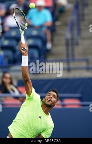 Felix Auger-Aliassime, of Canada, serves to Lucas Pouille, not shown ...