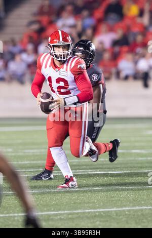 Ottawa Redblacks quarterback Jake Maier (13) throws the ball against ...