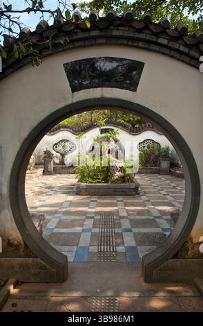 Moon gate at the traditional Fukushuen classical Chinese garden in ...