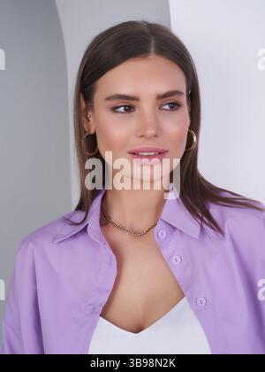 Elegant woman models contemporary fashion in a stylish studio setting ...