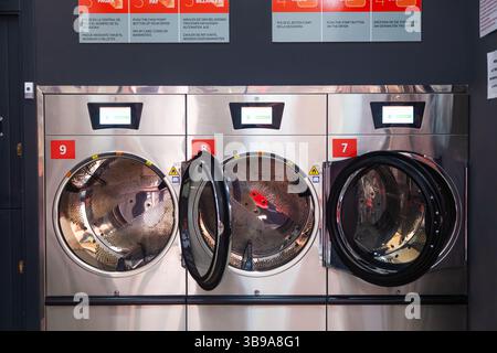 Professional washing machines installed in the city laundry Stock Photo ...