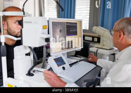 Optical coherence tomography (OCT) was performed measurement of ...