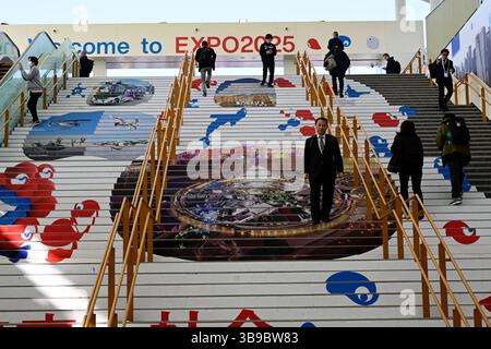 A poster for Osaka World Expo 2025 on the exit stairs of a subway ...