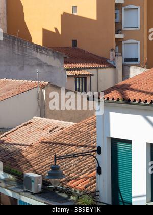 Vertical Wide-Angle View of Terracotta Rooftops and Layered ...