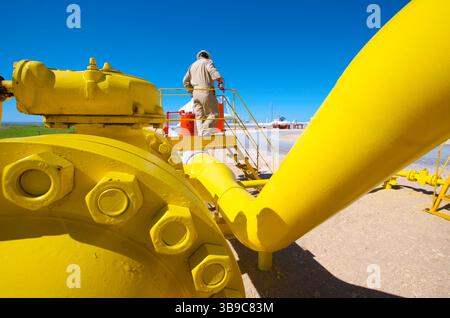 Oilfield operator makes his rounds Stock Photo - Alamy