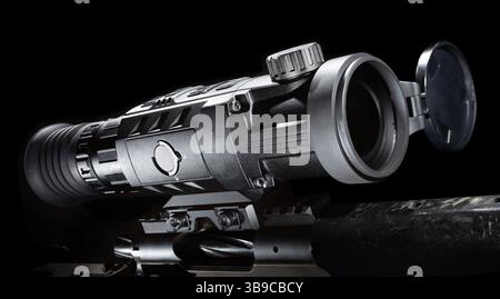 Thermal night vision scope for a rifle with cover closed seen at a ...