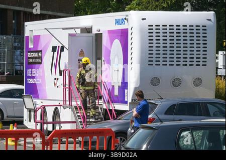 Firefighters and police are seen on the scene of a hospital fire in ...
