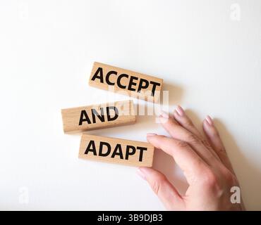 Accept or adapt symbol. Wooden blocks with words Accept and adapt ...