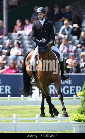 Harry Mutch of Great Britain with Shanbeg Cooley during the dressage at ...
