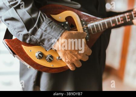 Close up hand playing Thai Mandolin, Phin in home studio Stock Photo ...