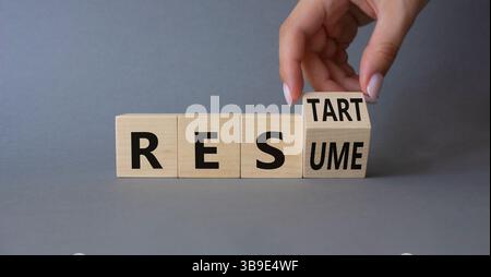 Restart and resume symbol. Businessman turns cubes and changes the word ...