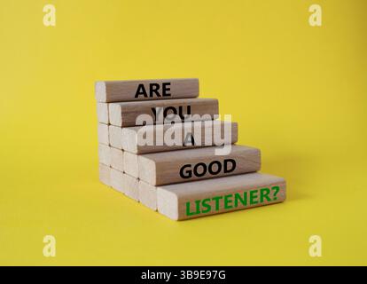 Listening skills symbol. Wooden blocks with words Are you a good ...