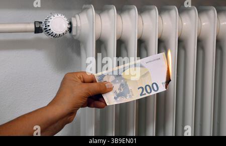 Burning money through inflation Stock Photo - Alamy