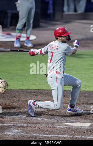 Philadelphia Phillies' Johan Rojas, right, steals third base against ...