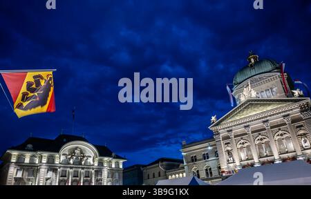A beautiful view of the Bundesplatz in Bern overlooking a park with ...