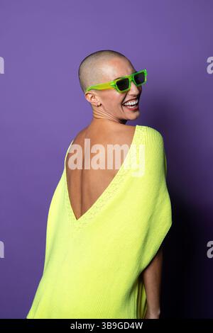 Woman Wearing Green Sunglasses Smiles at the Camera With a Light ...