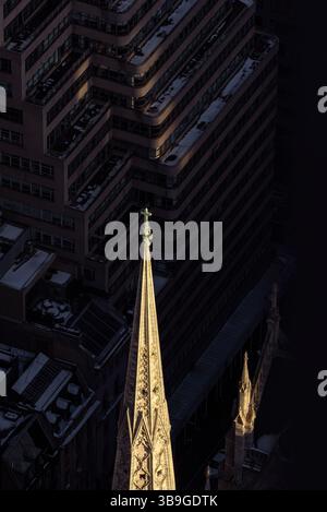 Aerial view of a beautifully illuminated cathedral at night in a ...