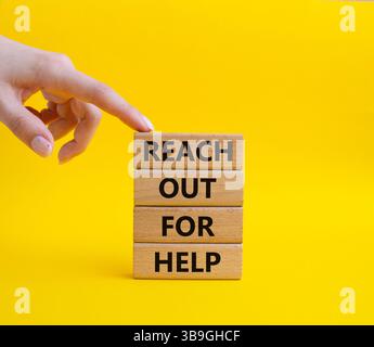 Reach out for help symbol. Wooden blocks with words Reach out for help ...