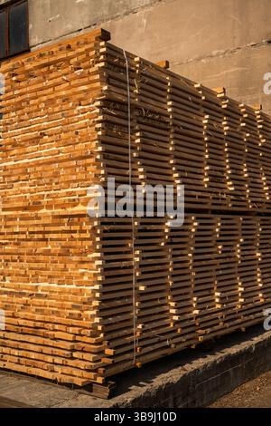 A pile of building materials near the warehouse Stock Photo - Alamy
