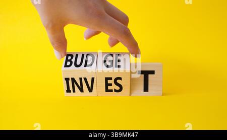 Budgeting or investing symbol. Businessman turns cubes and changes the ...