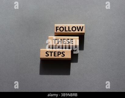Follow these steps symbol. Concept words Follow these steps on wooden ...