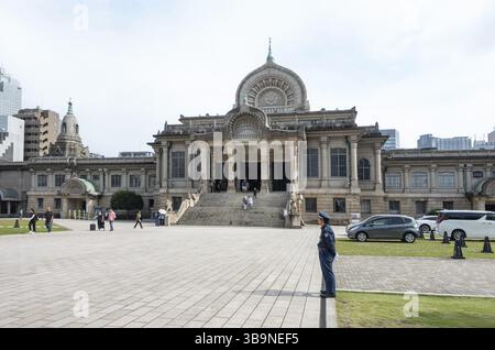 Security guard standing outside the Tsukiji Hongan-ji Buddhist temple ...