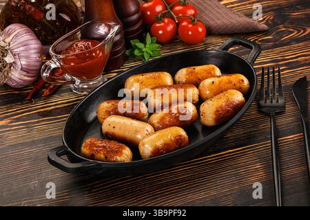 Roasted chicken mini sausages for breakfast in the bowl Stock Photo - Alamy