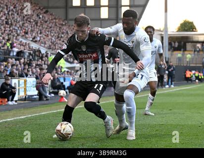 Notts County's Conor Grant (left) and Cheltenham Town's James Wilson ...