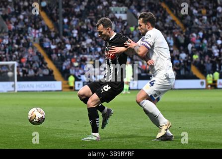 Notts County's Conor Grant (left) and Cheltenham Town's James Wilson ...