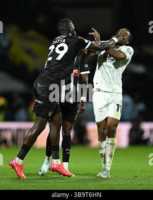 Notts County's Alassana Jatta (left) reacts to AFC Wimbledon's Josh ...