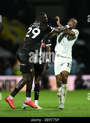Notts County's Alassana Jatta (left) reacts to AFC Wimbledon's Josh ...