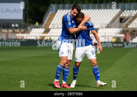Maxence Caqueret of Como 1907 celebrating with team mates after a goal ...