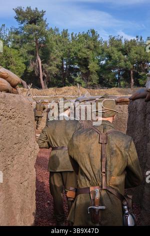 Turkish troops, looking on while comrades shoot at the enemy over the ...