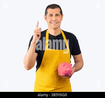 Handsome hispanic man wearing apron holding sew kit smiling happy and ...