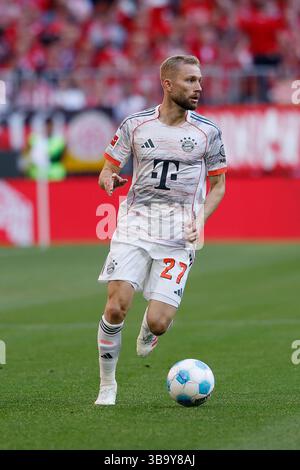 Konrad Laimer of FC Bayern München passes the ball during the ...