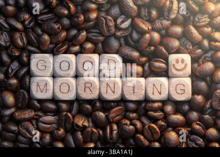 Good morning message with wooden blocks on coffee beans background ...